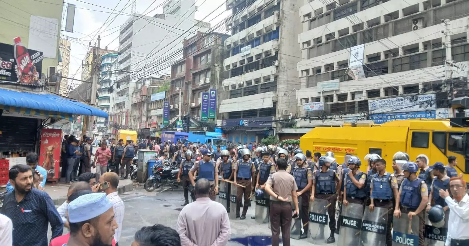 Police disperse protesters near Islami Bank headquarters with water ...
